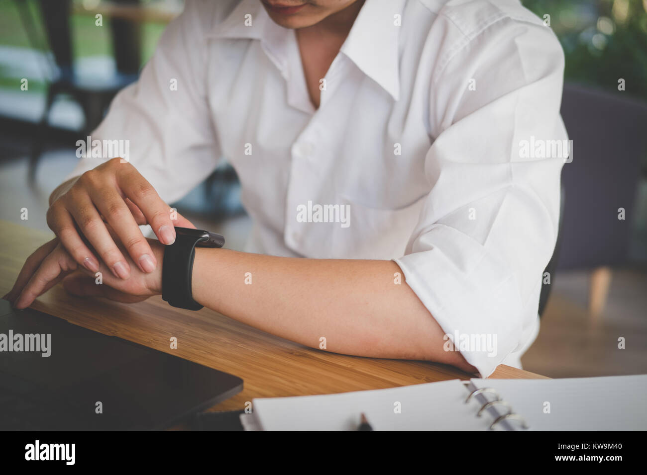 busy businessman look at smartwatch at workplace. startup man check ...