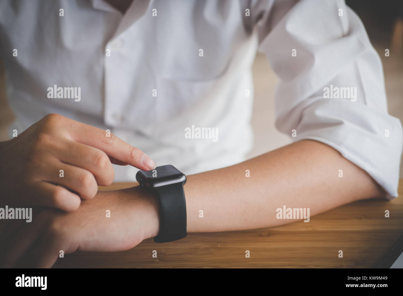 busy businessman look at smartwatch at workplace. startup man check ...