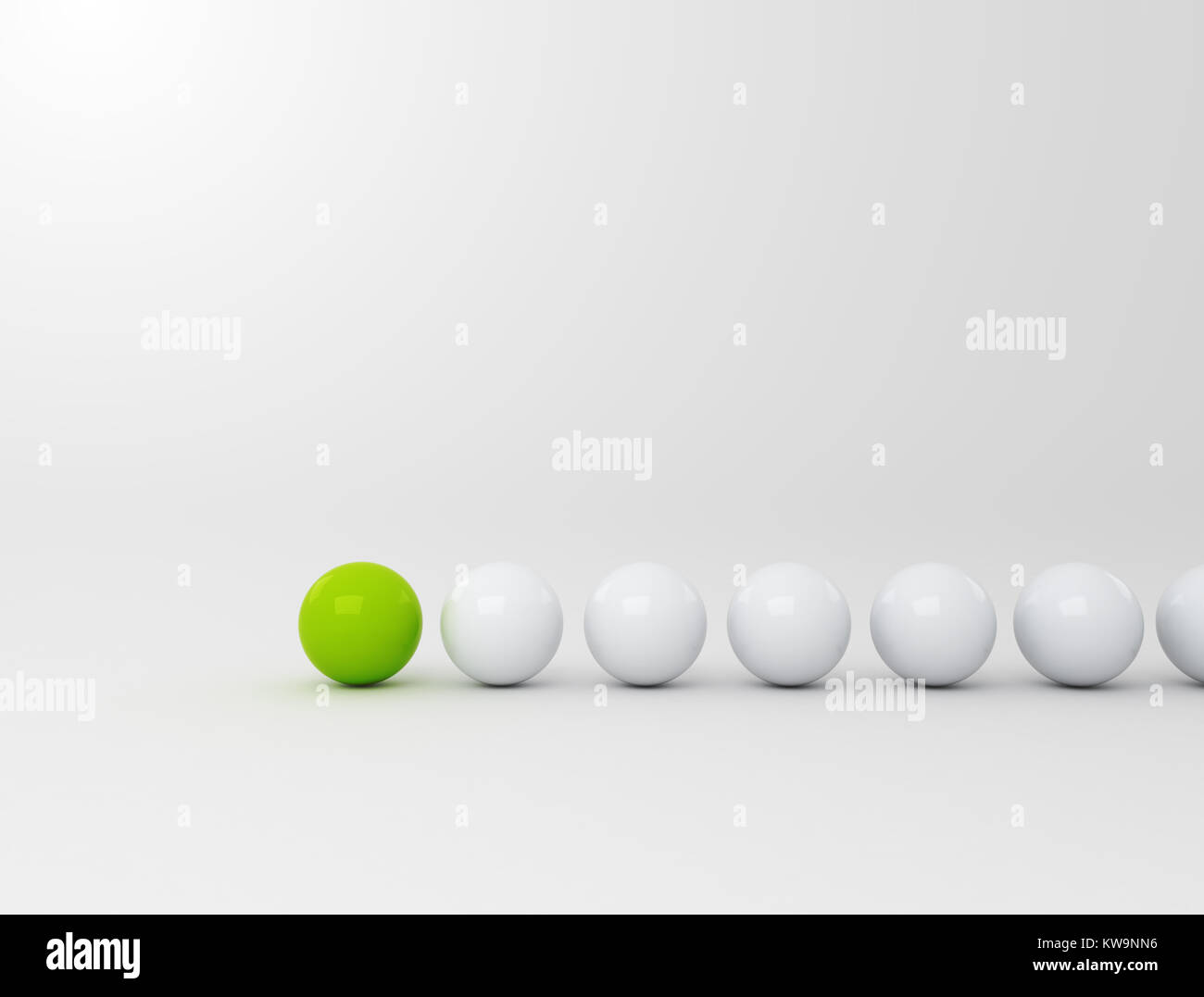 Row of white balls with green leader Stock Photo - Alamy