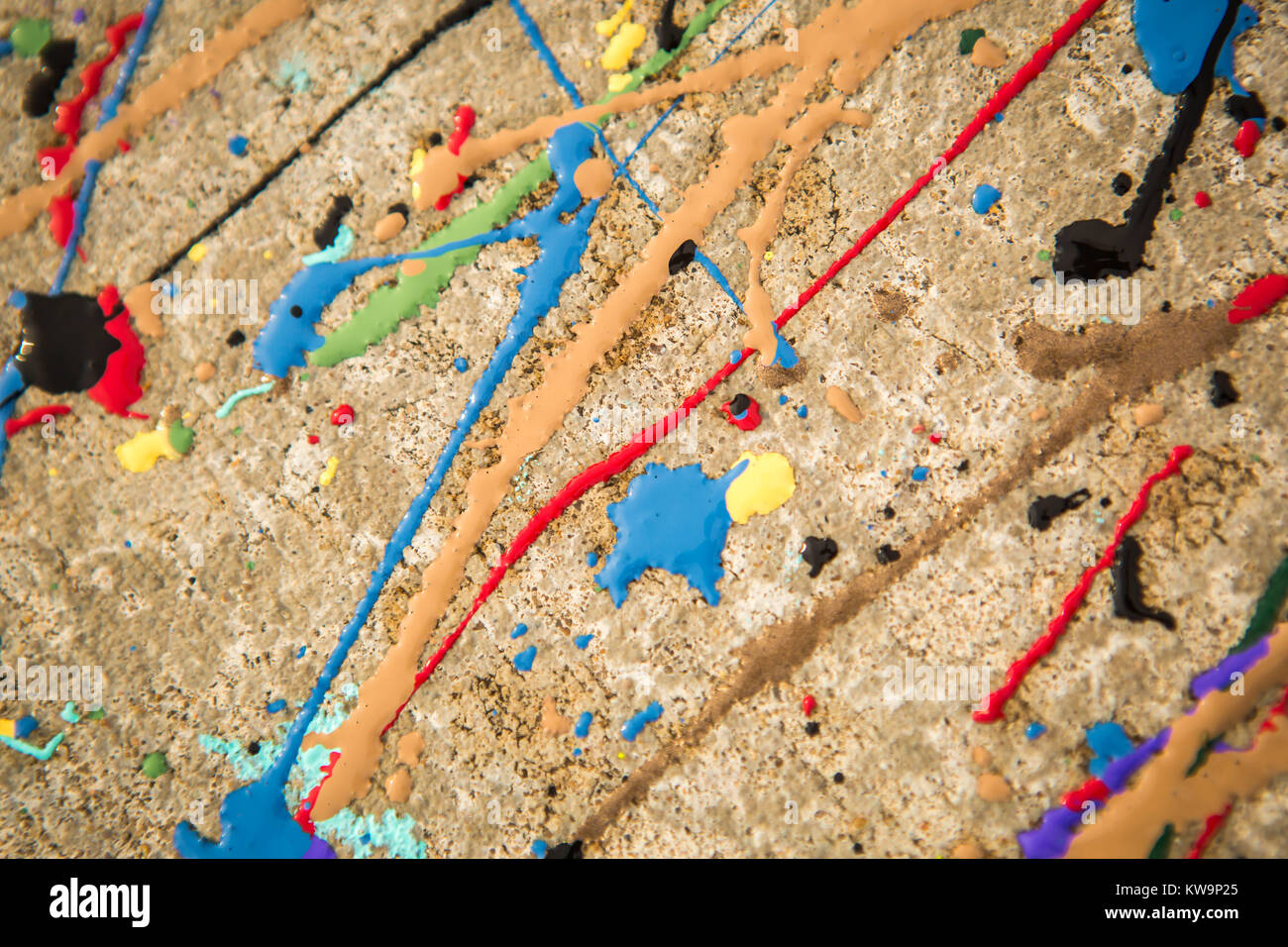 All the colors of rainbow swirled on and concrete using paint Stock ...