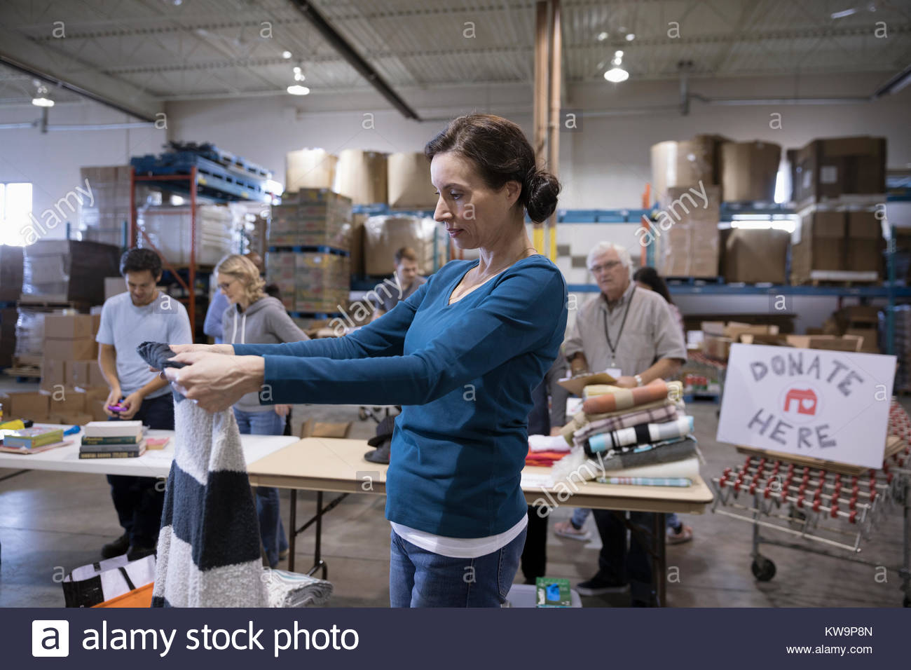 Women sorting clothing hi-res stock photography and images - Alamy