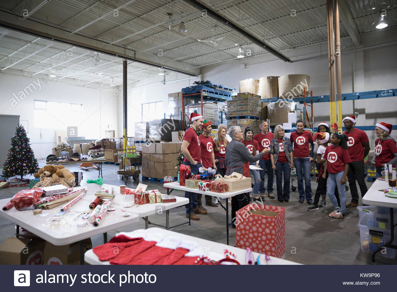 Christmas volunteers meeting in warehouse Stock Photo - Alamy