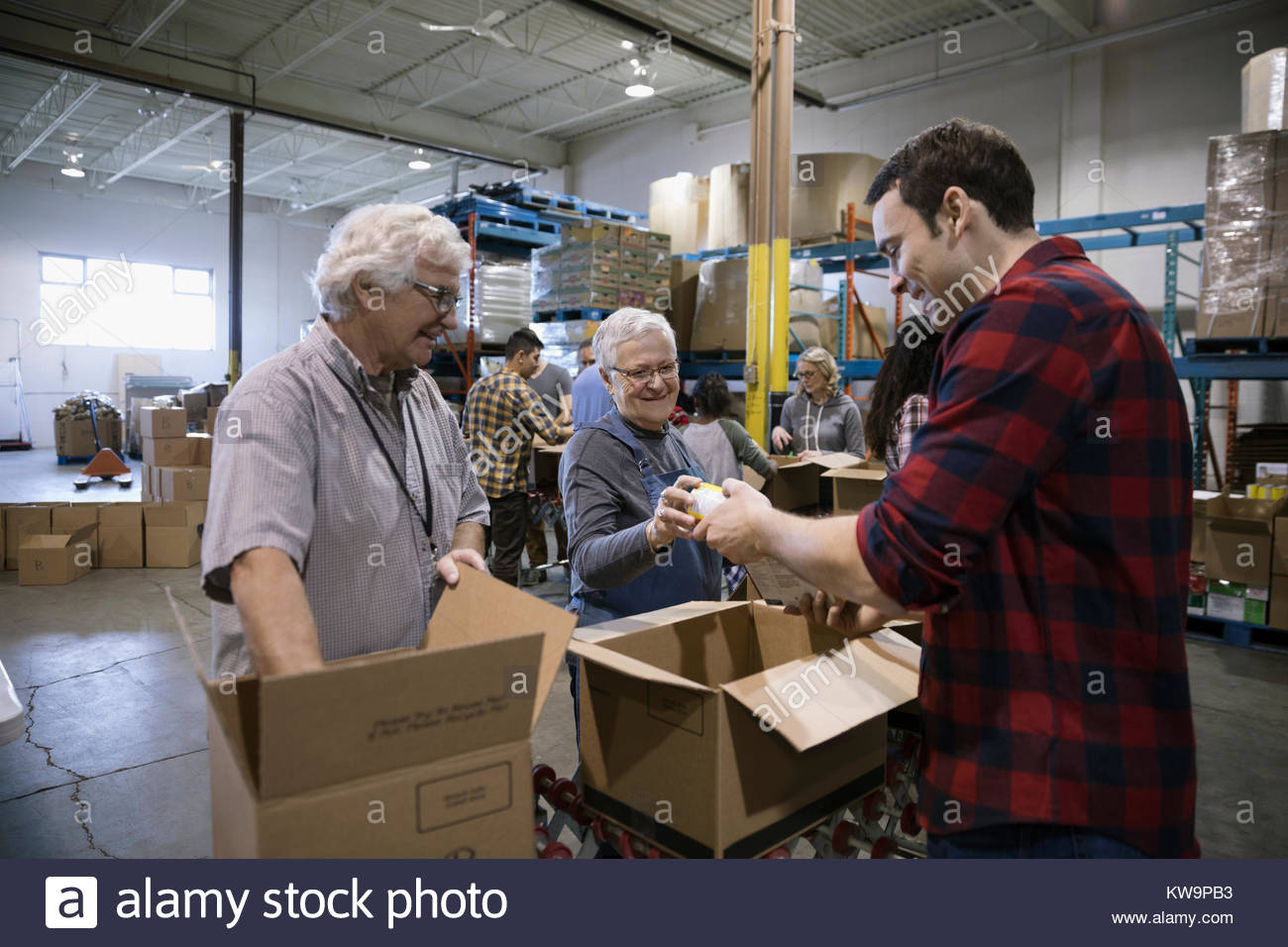 Man giving donation boxes hi-res stock photography and images - Alamy