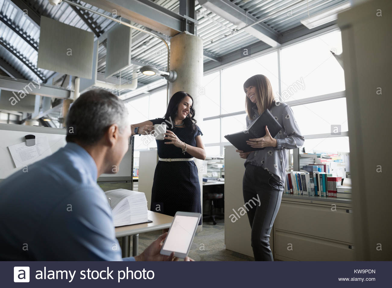 Business people meeting,talking in office cubicle Stock Photo - Alamy