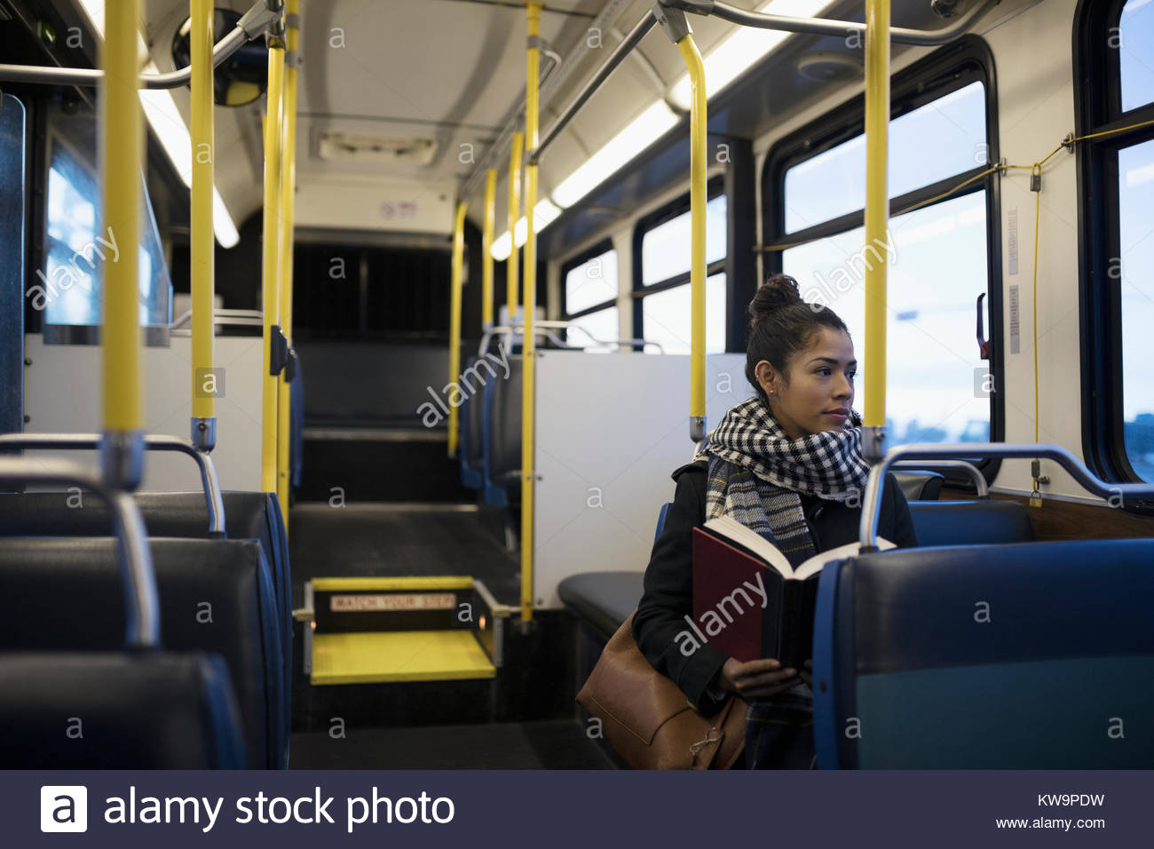 Reading on a bus hi-res stock photography and images - Alamy