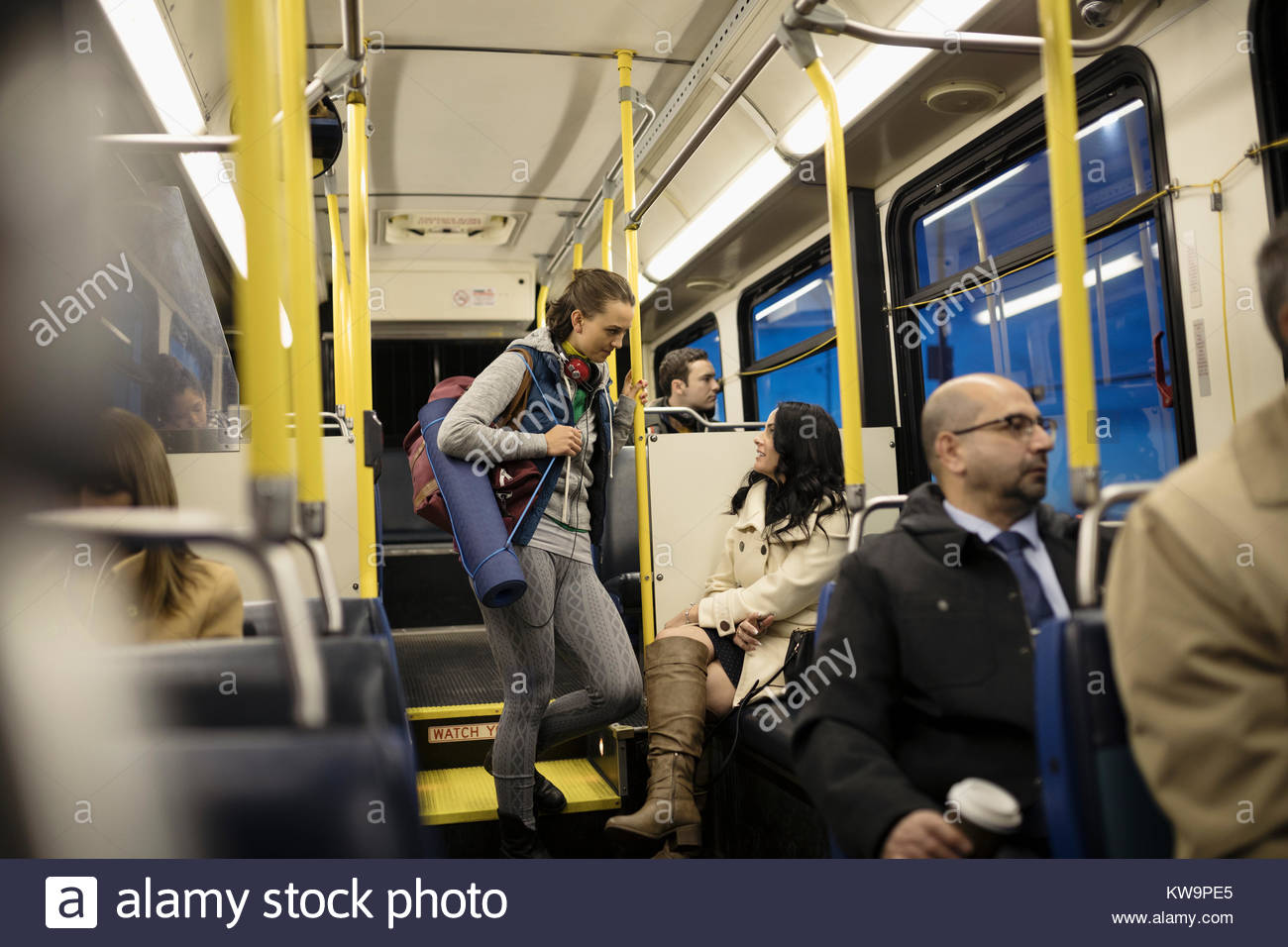 Female commuters talking on bus Stock Photo - Alamy