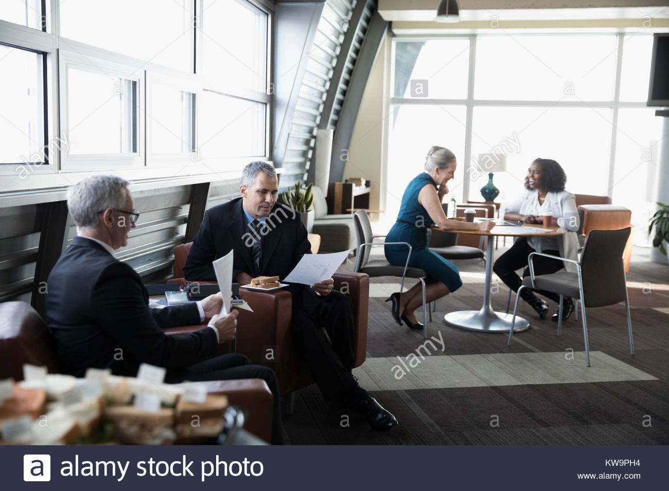 Business people talking in lounge hi-res stock photography and images ...