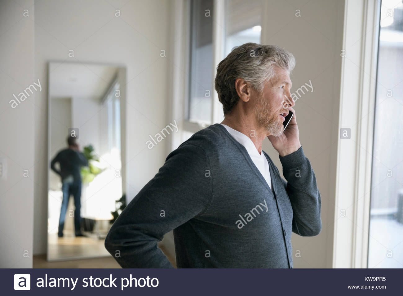 Man through window holding hi-res stock photography and images - Alamy