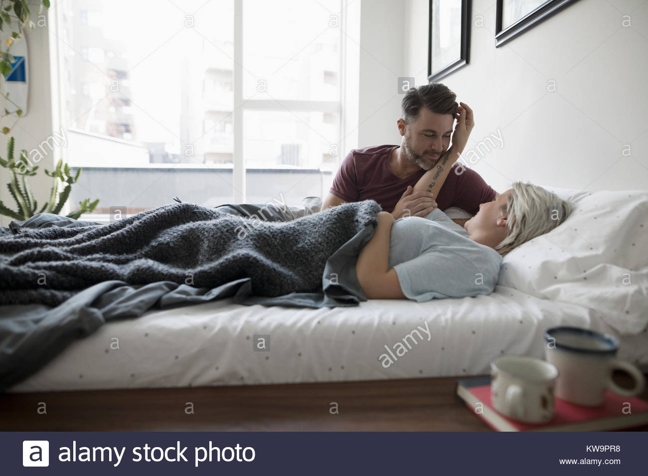Couple in bed hi-res stock photography and images - Alamy