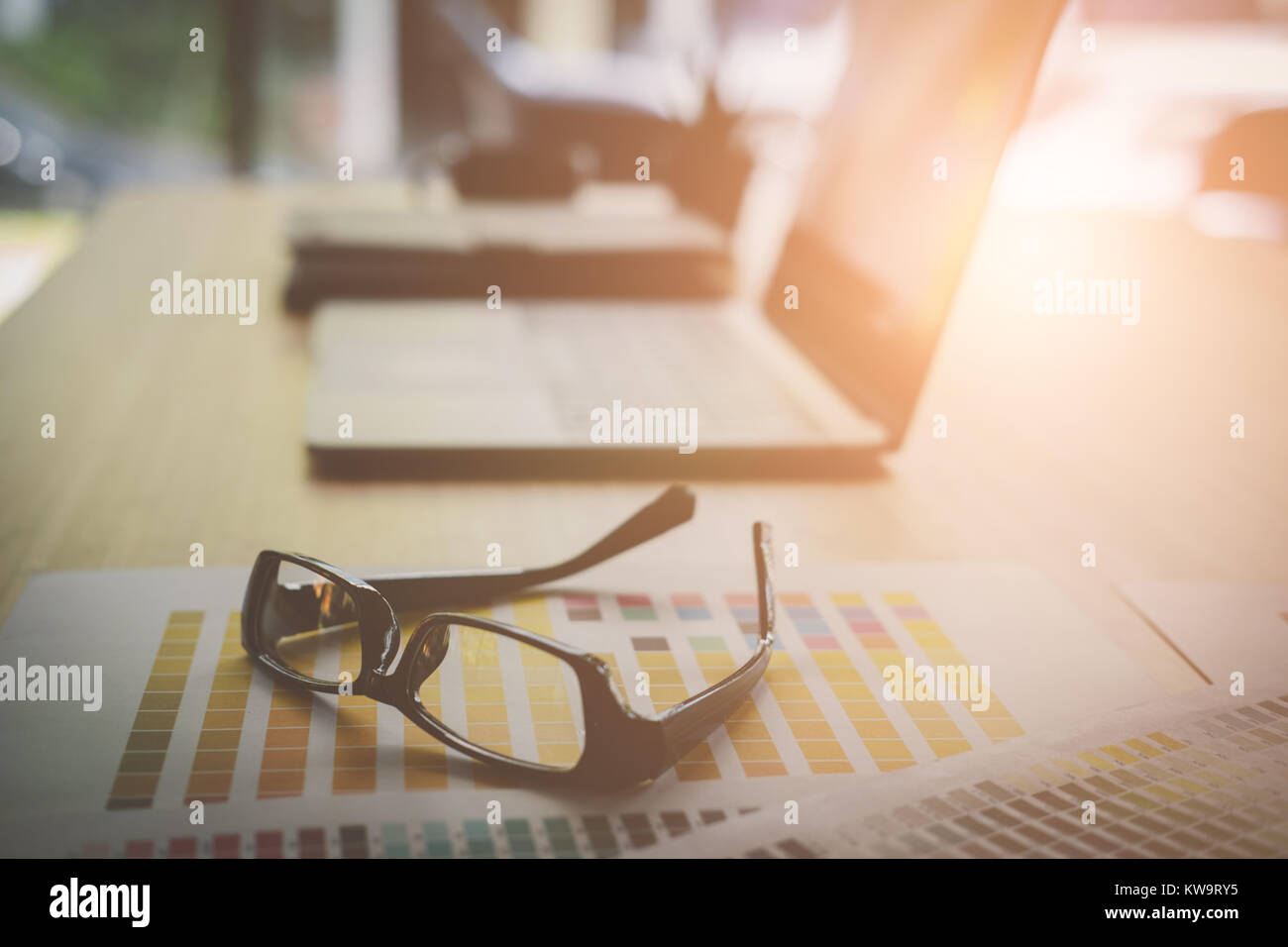 eyeglasses, color swatch sample on office desk. graphic designer ...