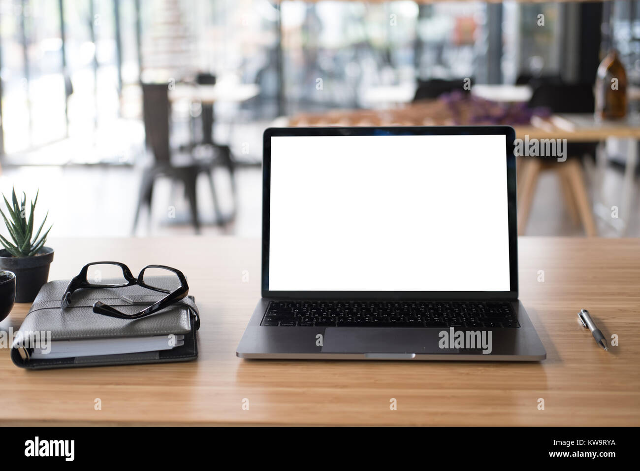 ballpoint pen, computer, eyeglasses, notebook on office desk. business ...