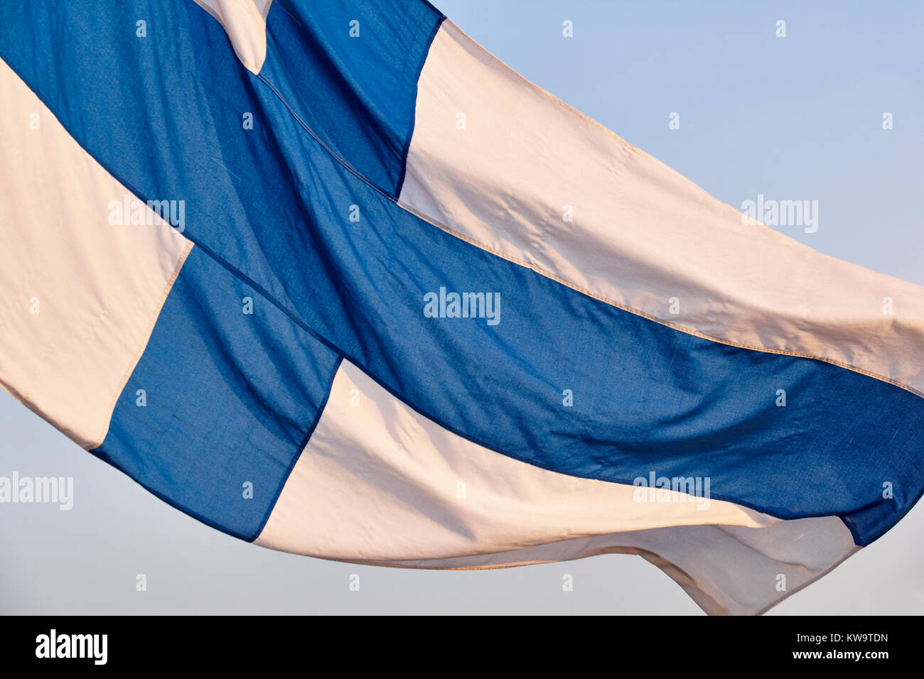 Finnish flag under a blue sky. Finland symbol. Europe. Horizontal Stock ...