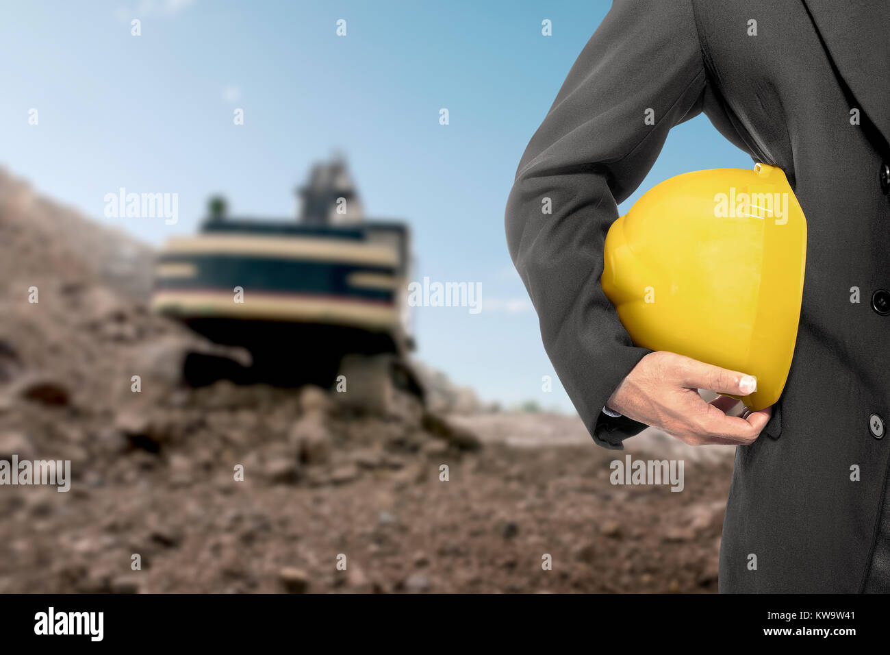 Engineer holding yellow helmet hi-res stock photography and images - Alamy
