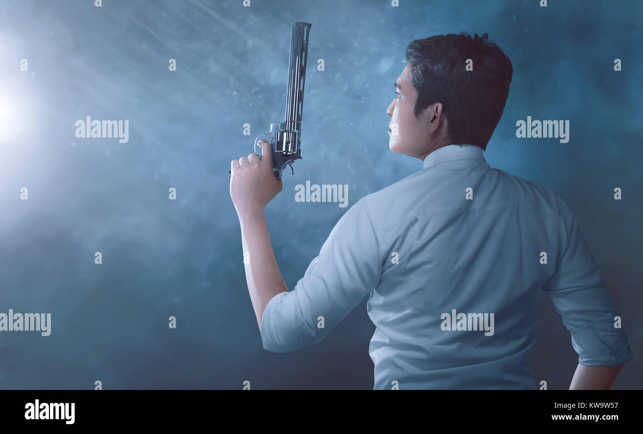 Policeman holding gun hi-res stock photography and images - Alamy