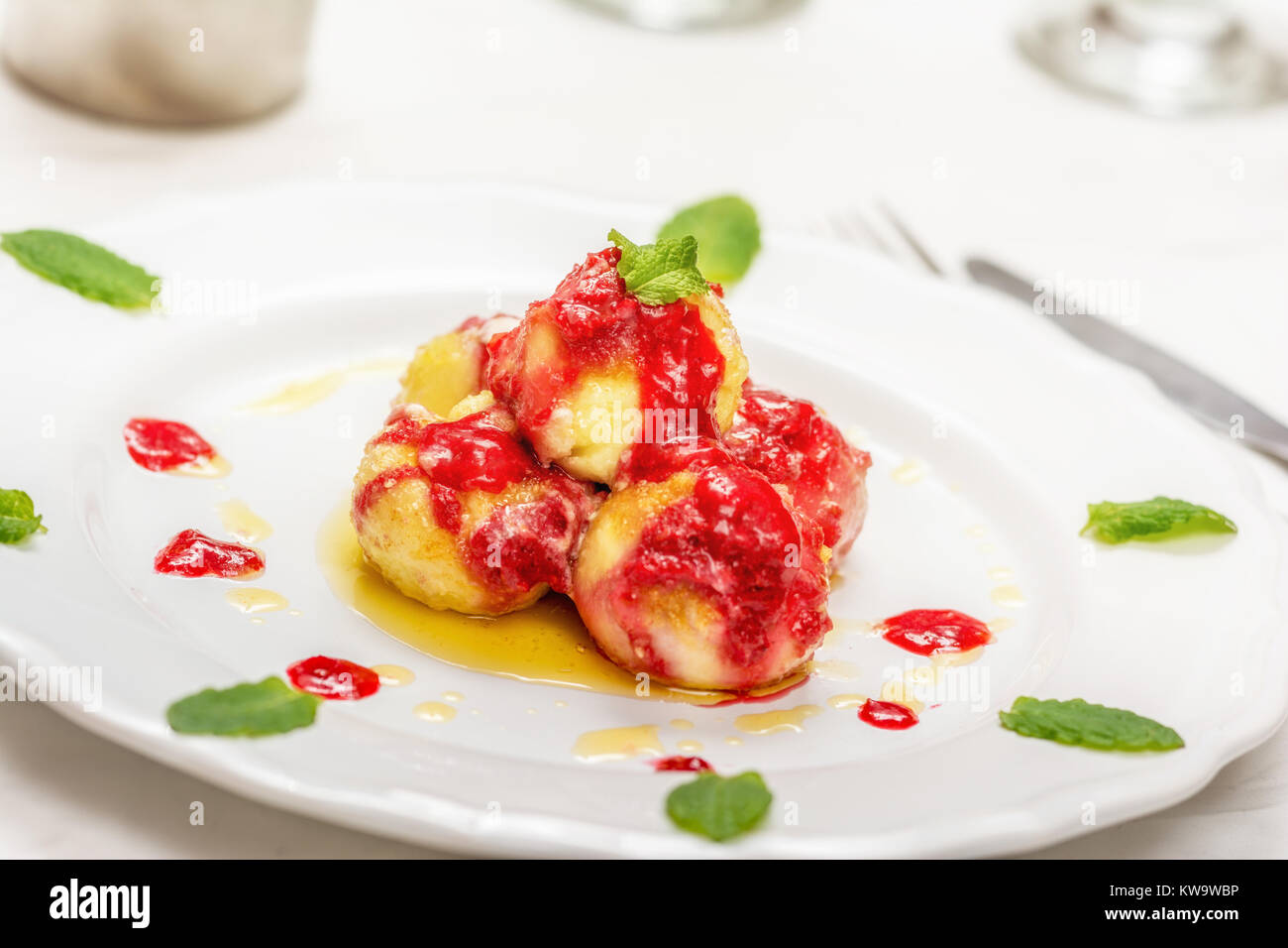 Traditional czech blueberry dumplings with raspberry coulis Stock Photo ...
