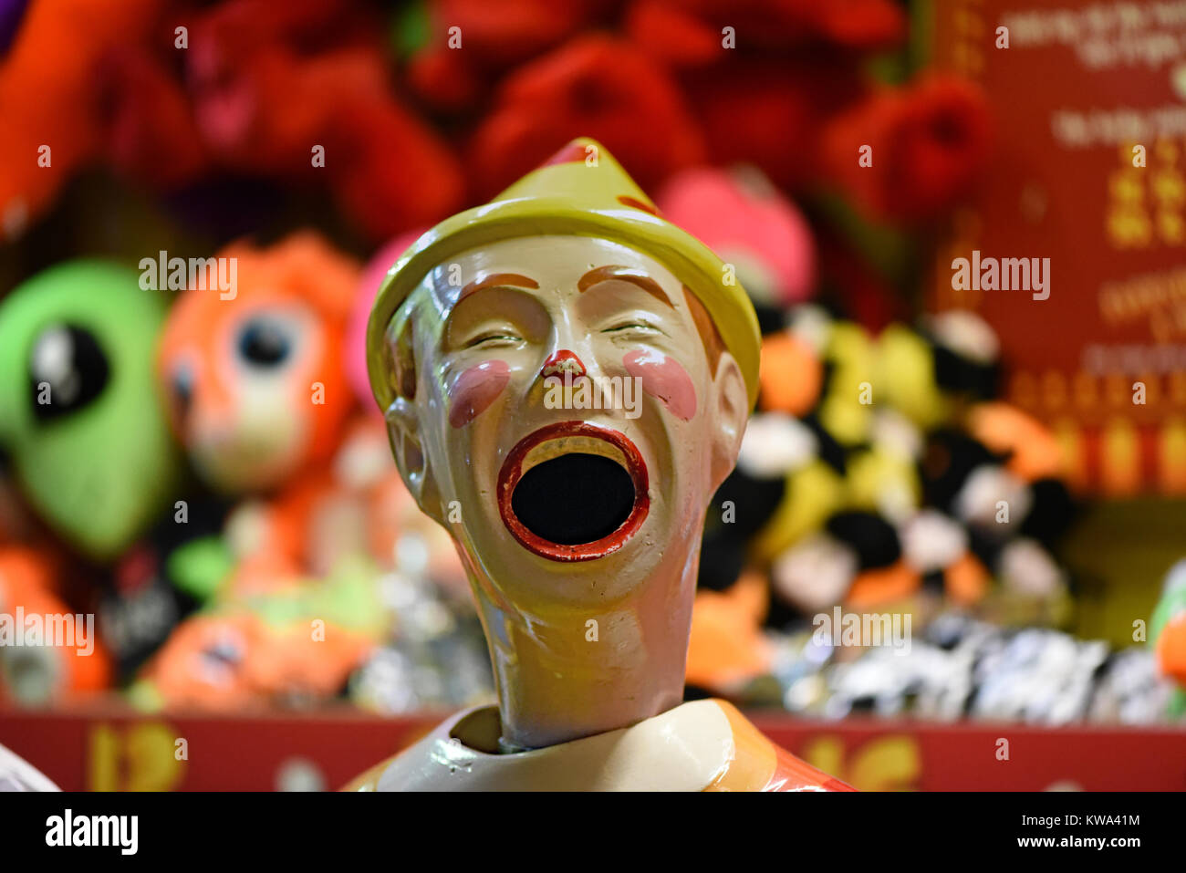 Brightly coloured laughing clowns at an amusement park Stock Photo - Alamy