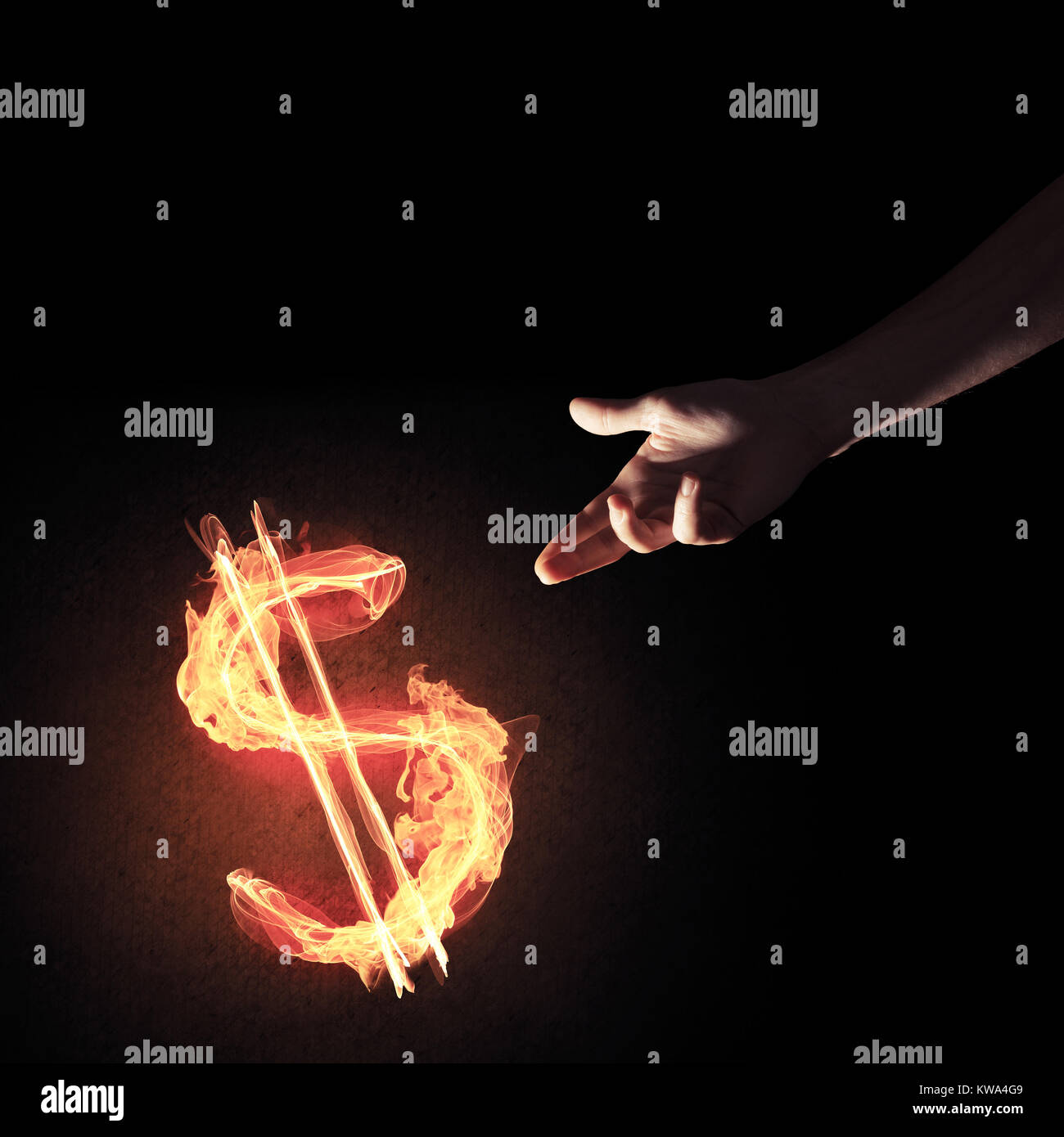 Close of man hands pointing at fire glowing dollar sign Stock Photo - Alamy