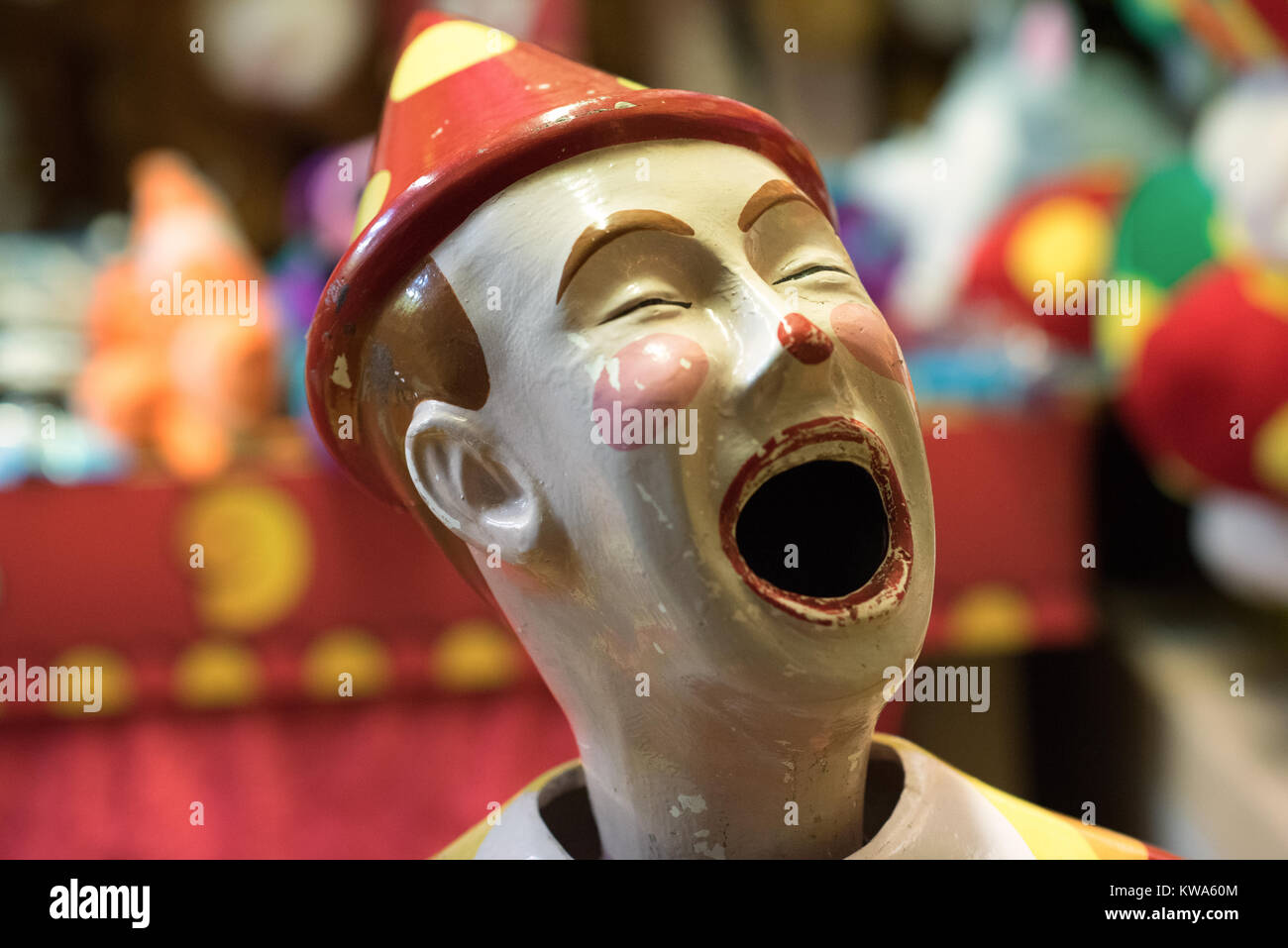 Brightly coloured laughing clowns at an amusement park Stock Photo - Alamy