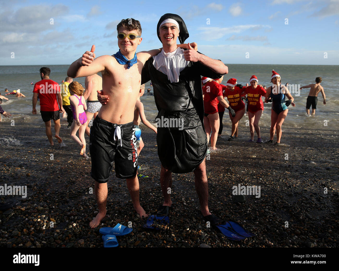 People take part in the annual New Year's day charity swim at Bray ...