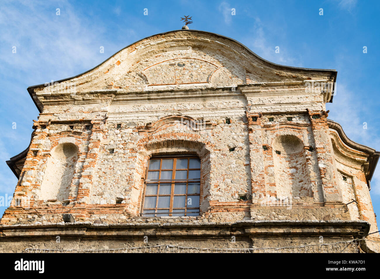 Detail of an ancient baroque Italian church built in stones and bricks ...