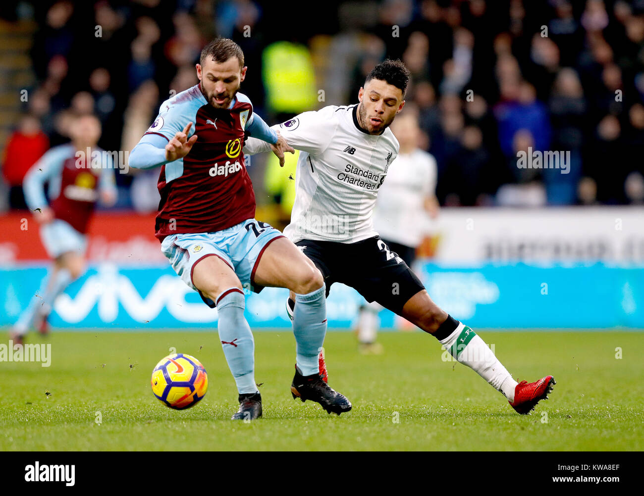 Burnley's Phil Bardsley (left) and Liverpool's Alex Oxlade-Chamberlain ...