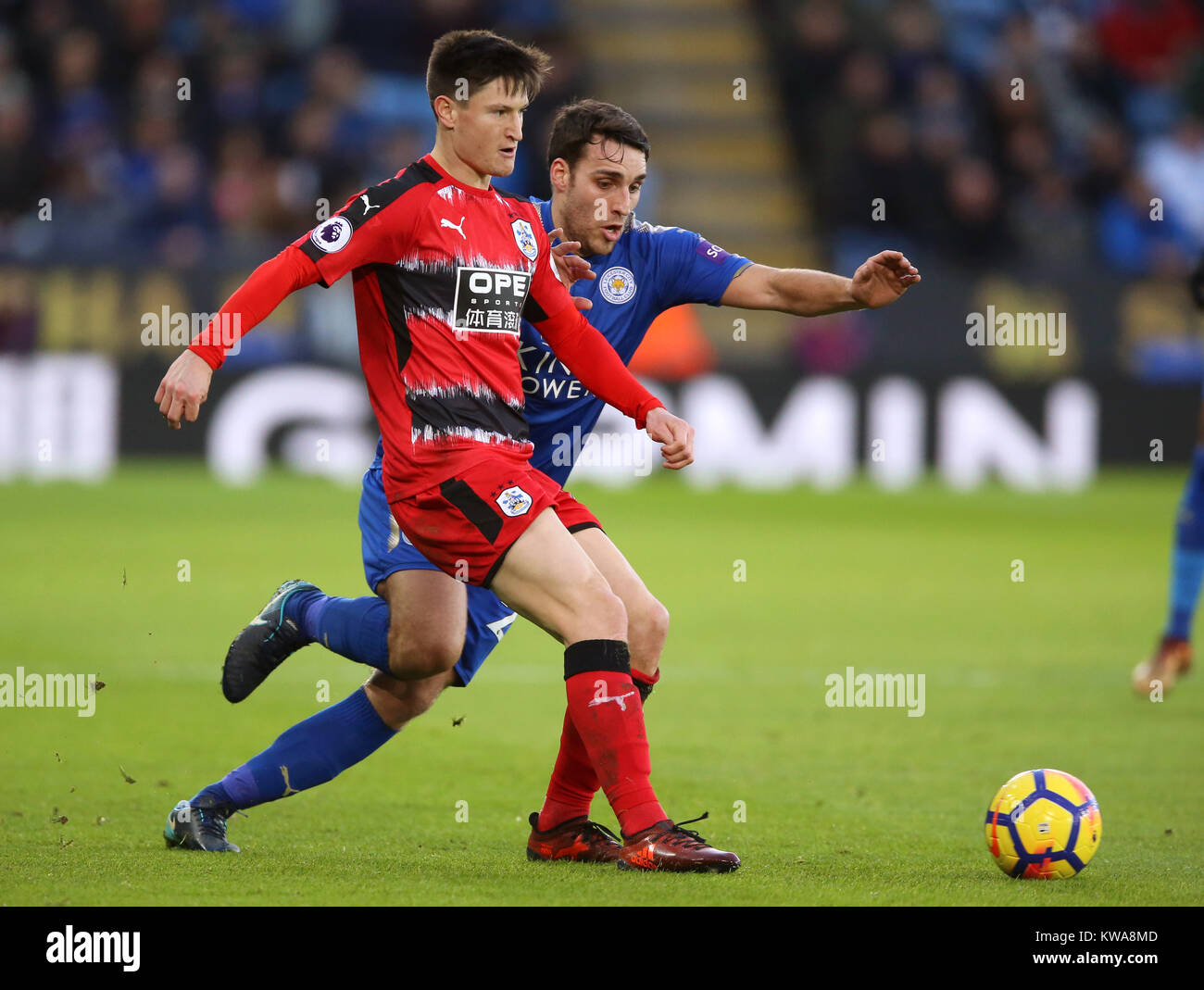 Huddersfield Town's Joe Lolley (left) and Leicester City's Matty James ...