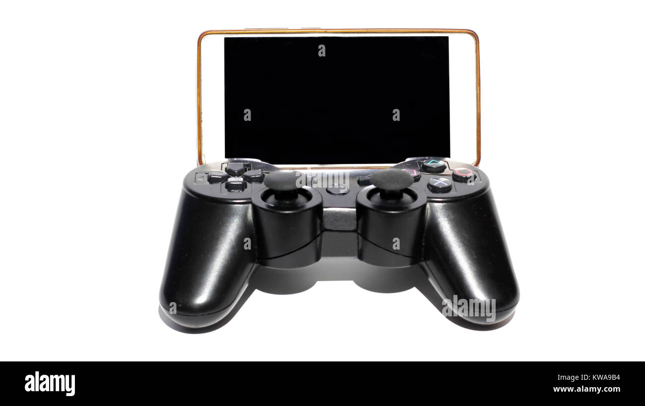 video game controller on a white background with smart phone monitor ...
