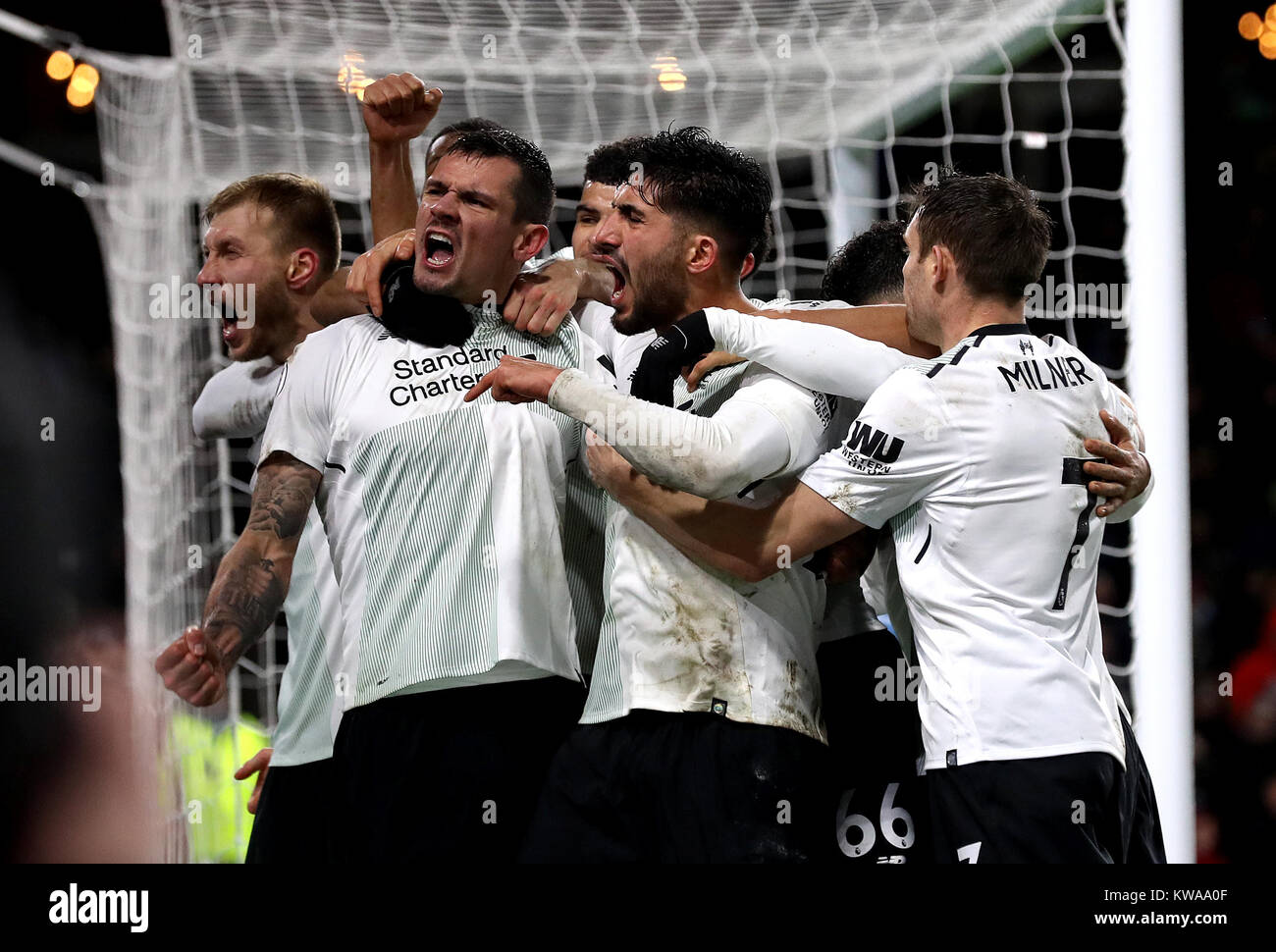 Liverpool's Ragnar Klavan (left) celebrates scoring his side's first ...