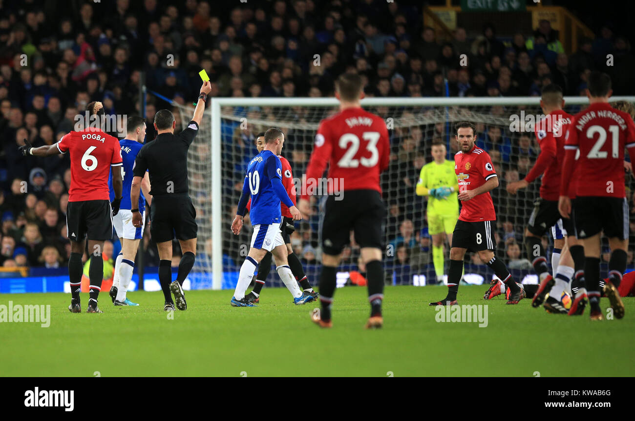 Everton's Wayne Rooney gets a yellow card for a foul during the Premier ...