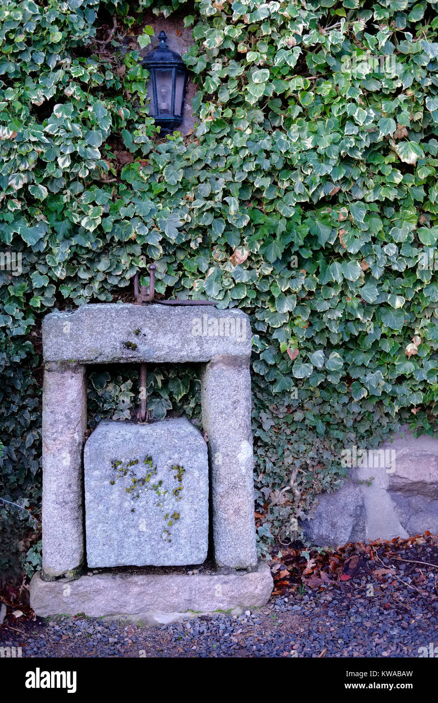 Cheese press traditional old granite stone making tool Stock Photo - Alamy