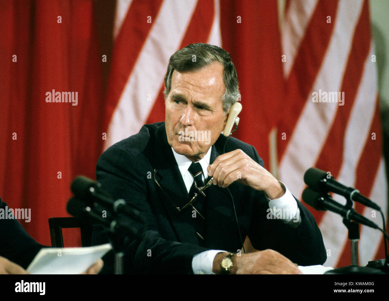 United States President George H.W. Bush listens during a joint press ...