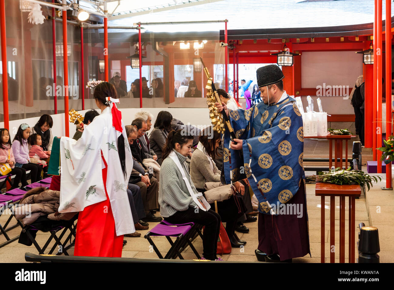 Japan, Kobe, Ikuta Shinto Shrine. Priest and miko, shine maidens ...