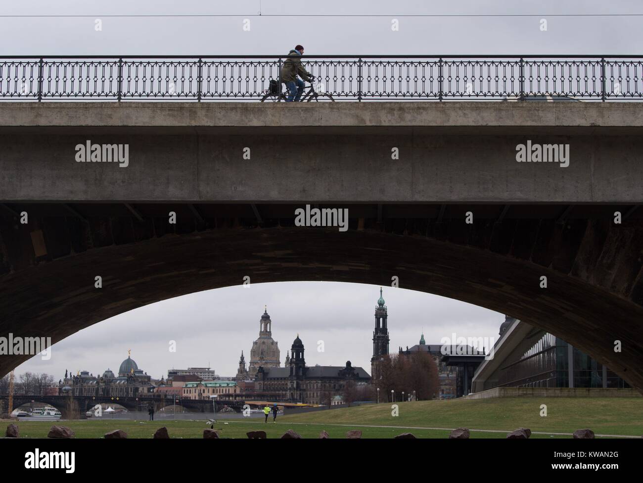 Dresden, Germany. 2nd Jan, 2018. A cyclist rides along the Marien ...