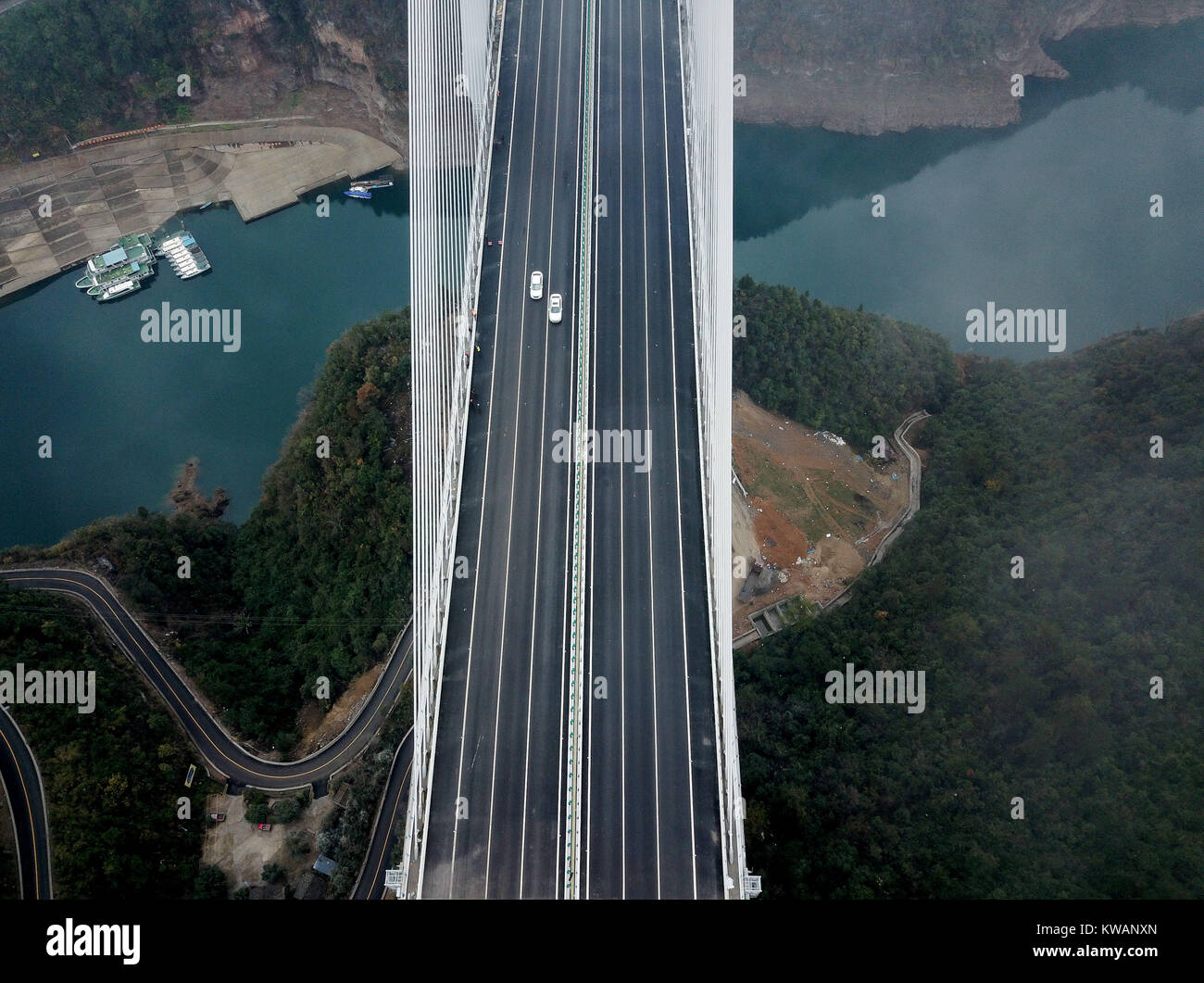 Guiyang. 2nd Jan, 2018. Vehicles run on a bridge of the new highway ...