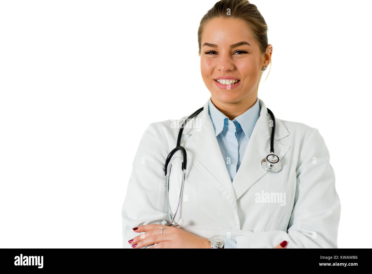 Portrait of smiling medical woman doctor by white wall Stock Photo - Alamy