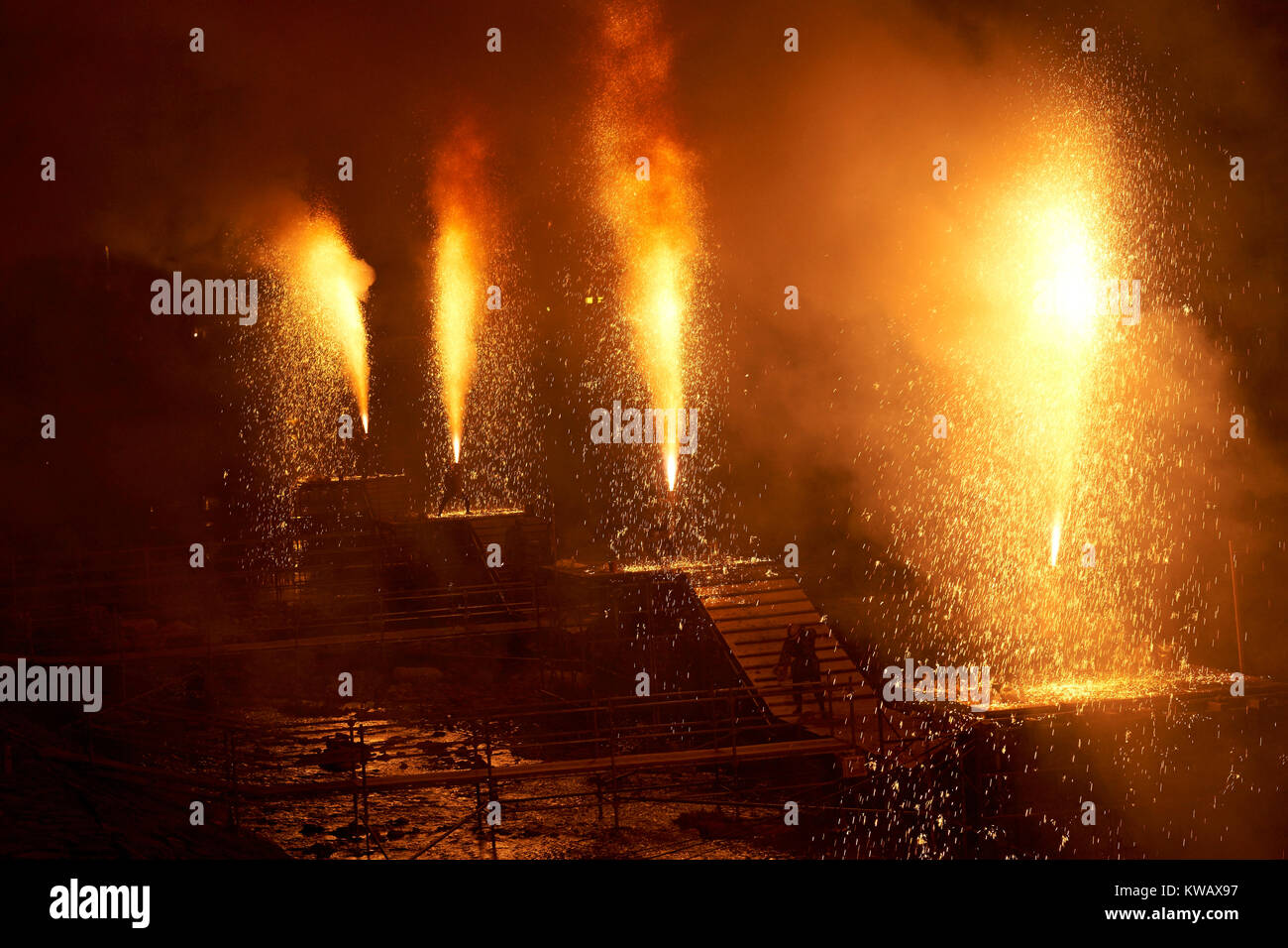 Traditional Japanese fireworks deployed from handheld bamboo cylinders ...