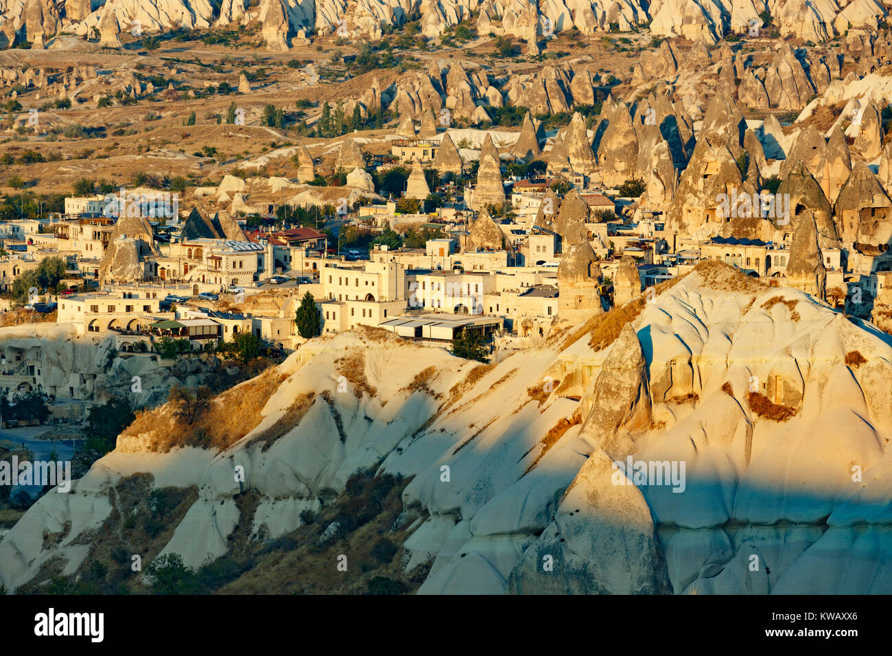 Fairy chimneys and Village of Goreme, Cappadocia, Turkey Stock Photo ...