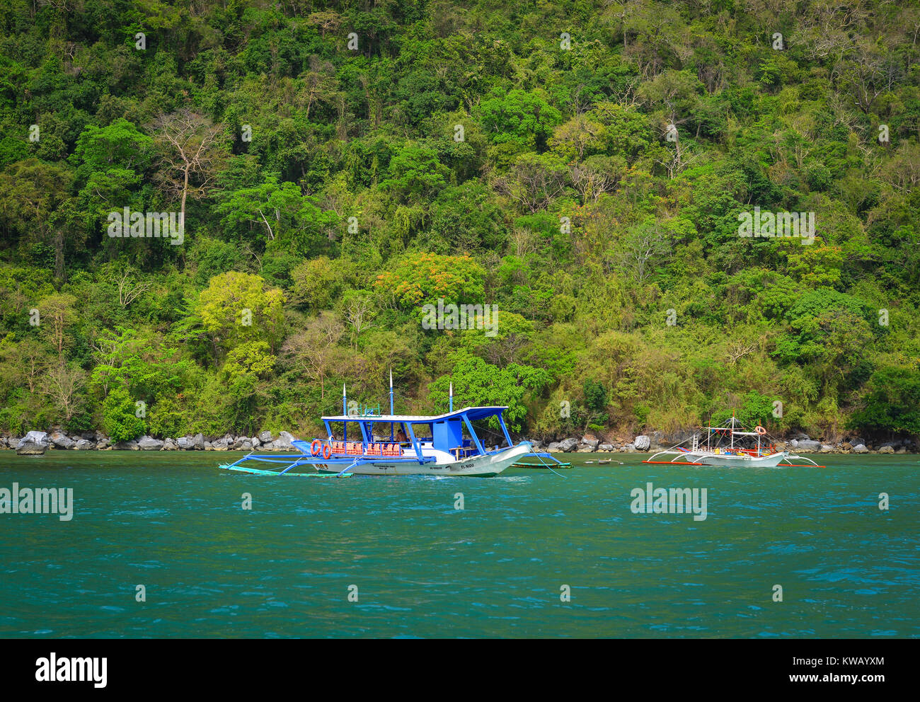 Palawan, Philippines - Apr 5, 2017. Tourist boats on the sea at sunny ...