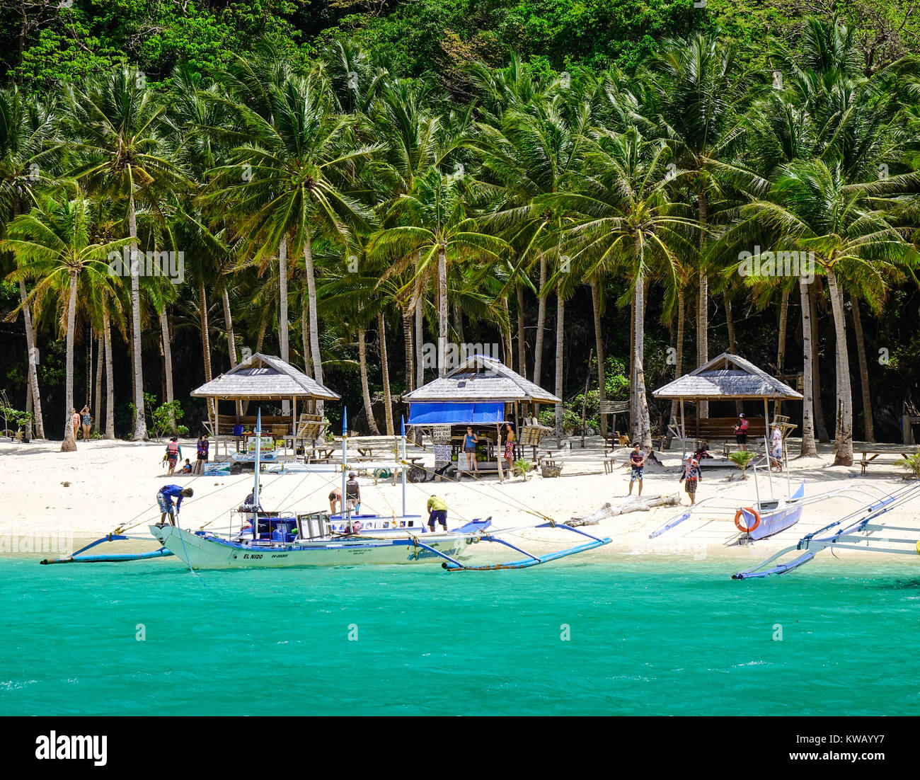Palawan, Philippines - Apr 5, 2017. People sun-bathing on the beach ...