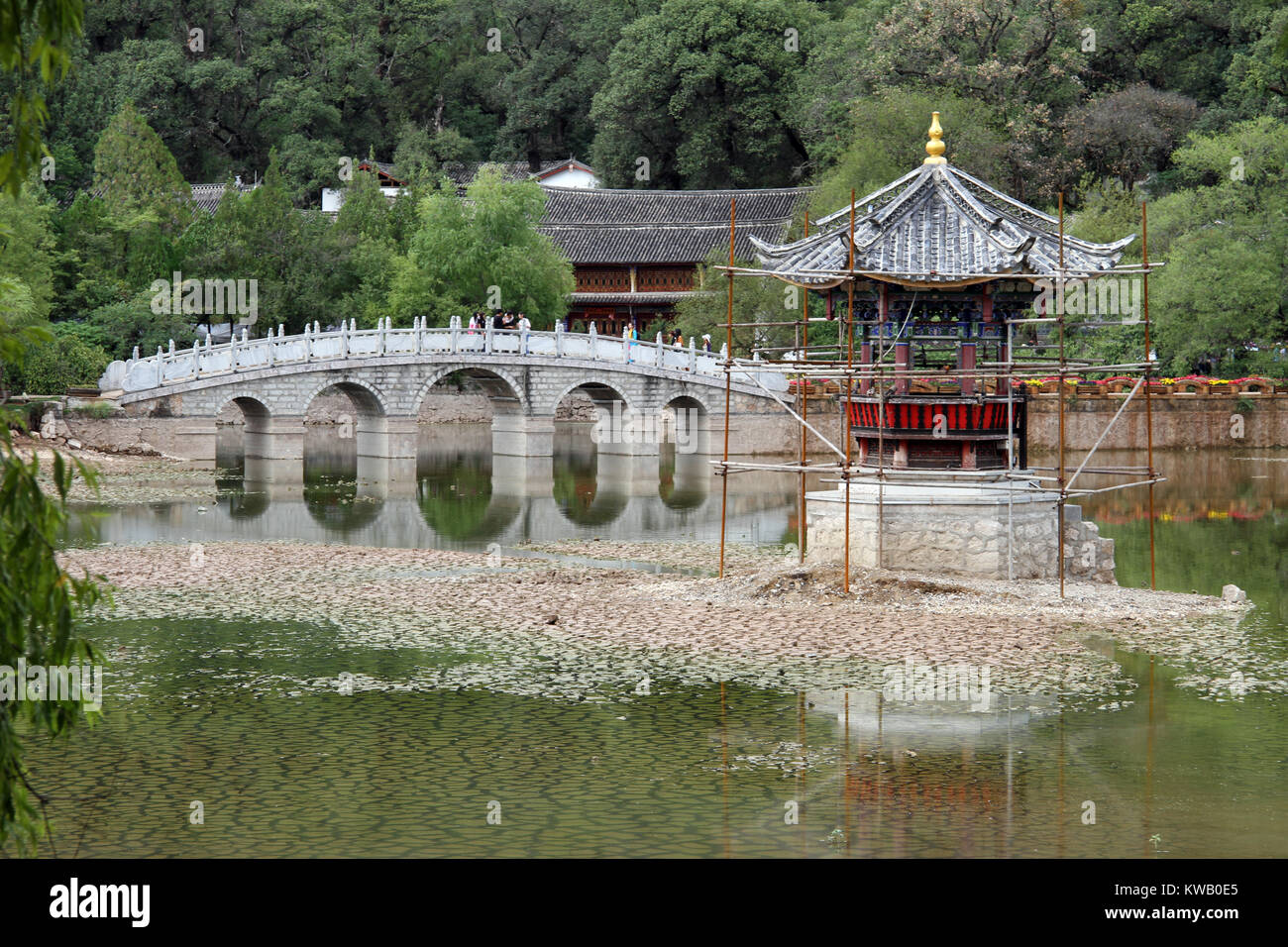 Water in the pond after drought and pagoda in Lijing, China Stock Photo ...