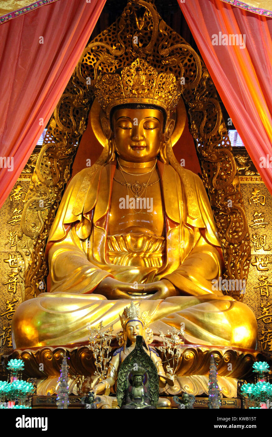 Statue of Guan Yin inside buddhist temple on the Putoshan island, China ...