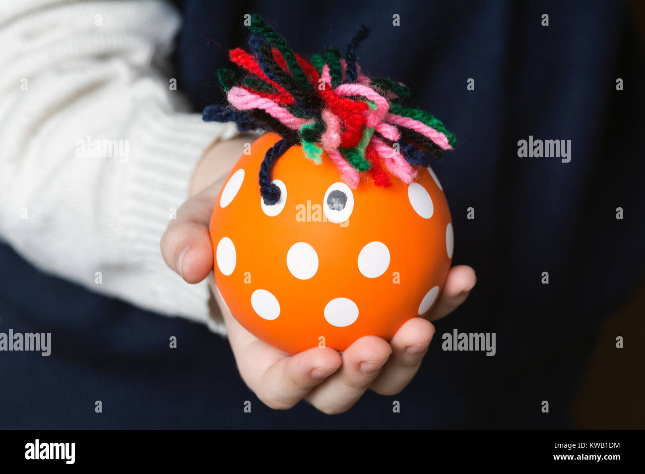 Soft rubber toy in children hands Stock Photo - Alamy