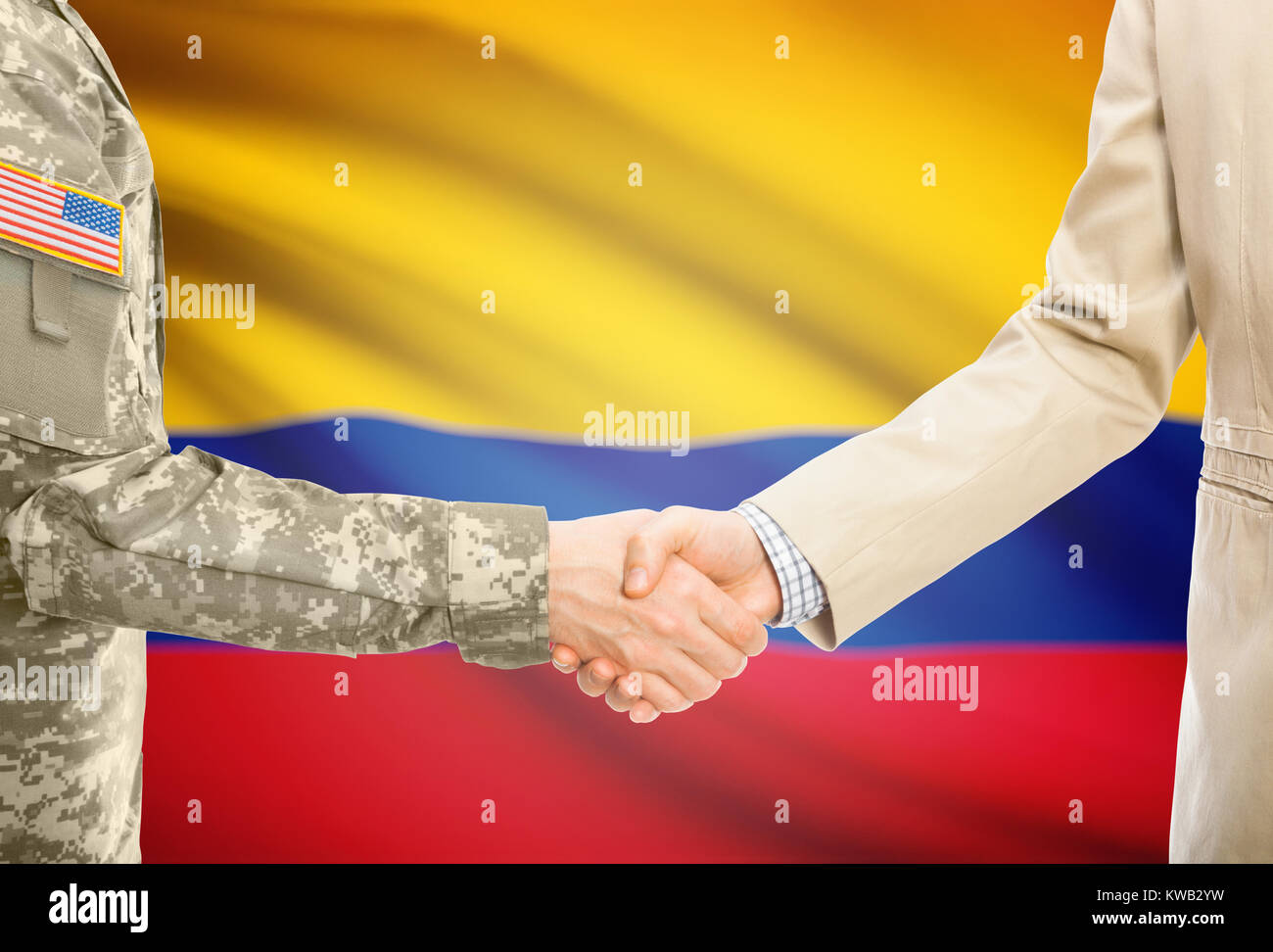 American soldier in uniform and civil man in suit shaking hands with ...