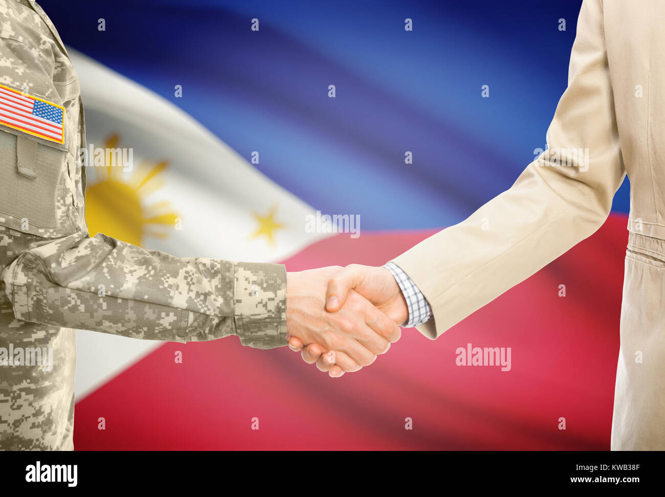 American soldier in uniform and civil man in suit shaking hands with ...