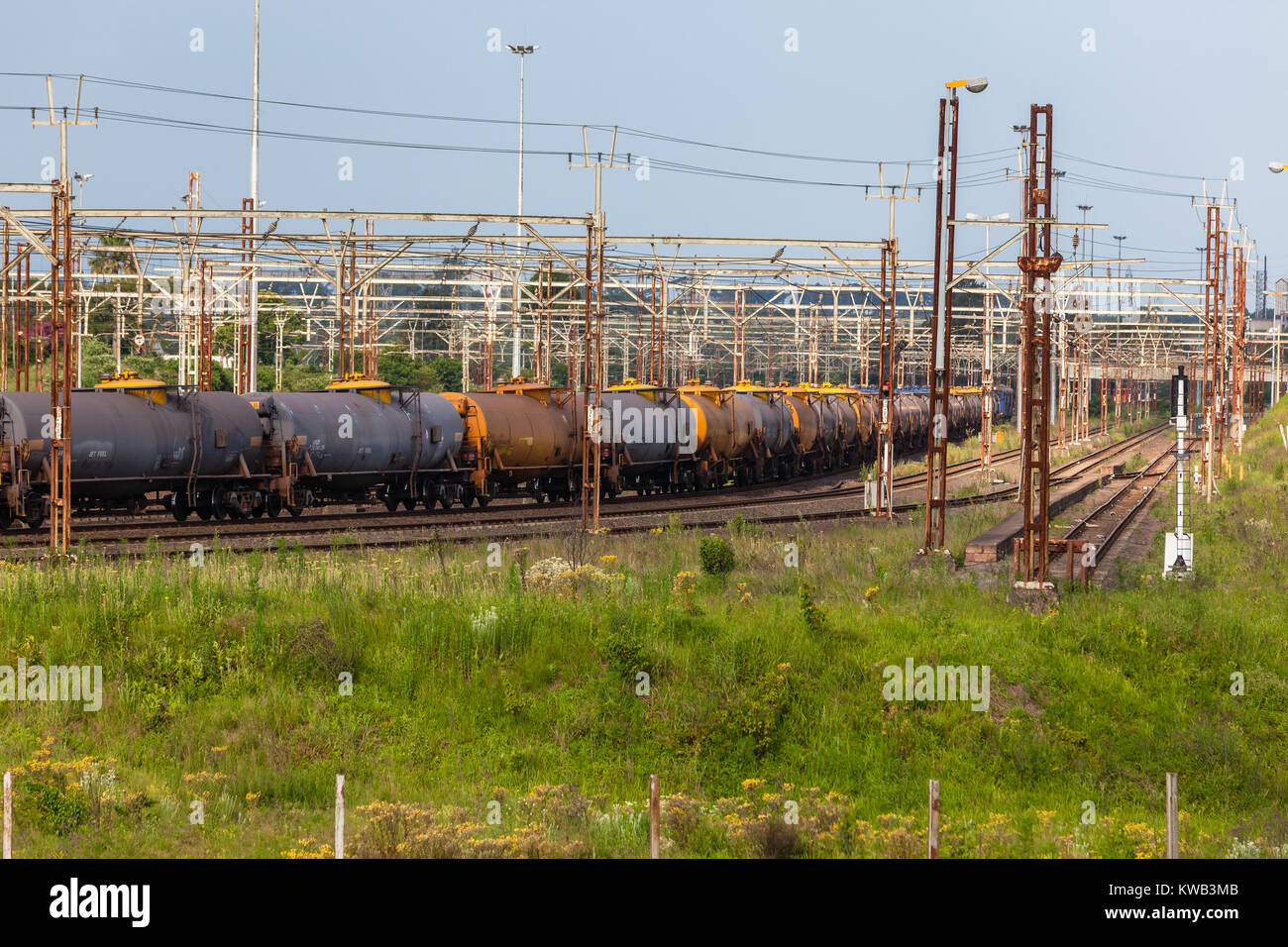 Train with cargo pulls into station transporting jet fuel tankers Stock ...