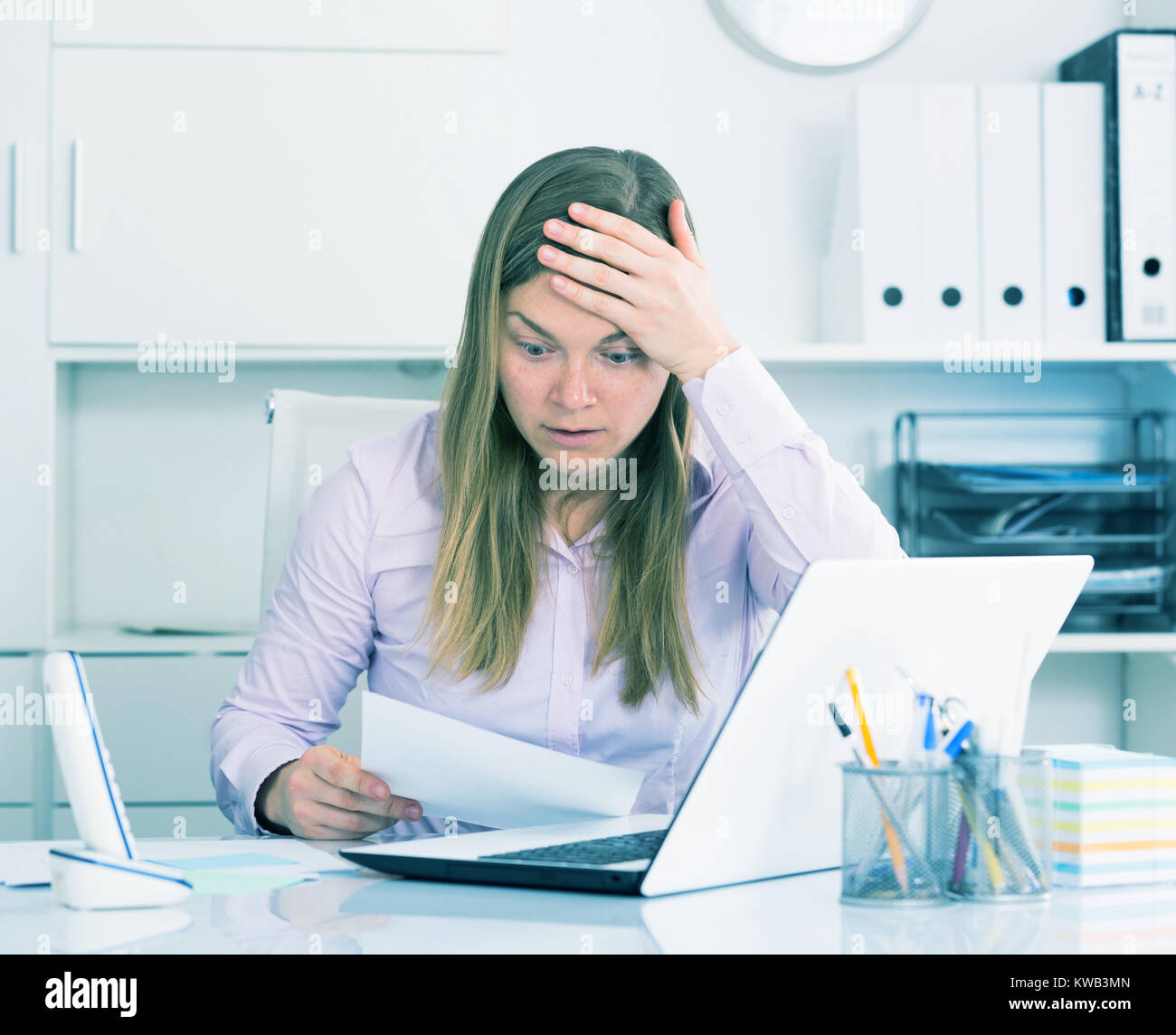 Young woman worker facing challenge in project in office Stock Photo ...