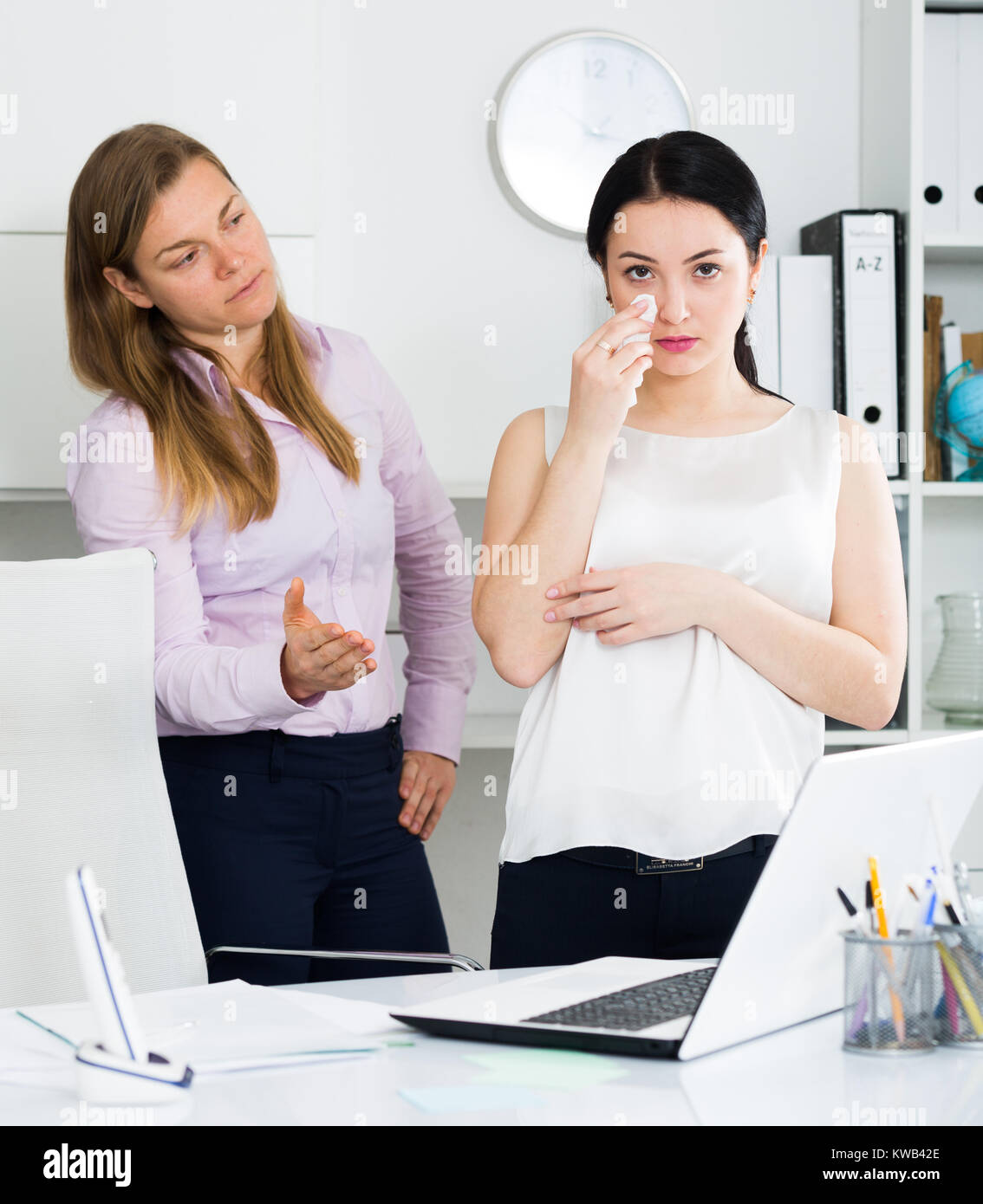 Female senior manager telling off her co-worker during working day ...