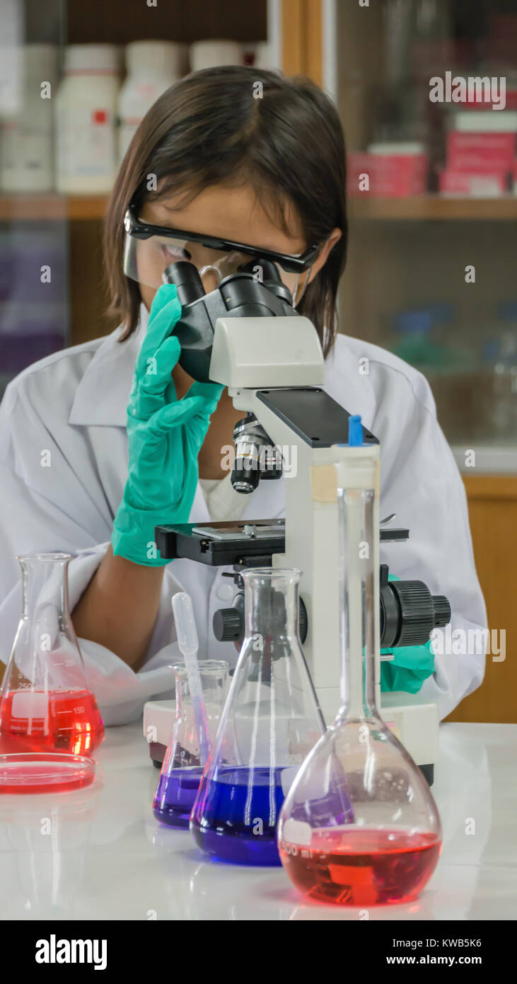 asian little girl looking with microscope in laboratory Stock Photo - Alamy
