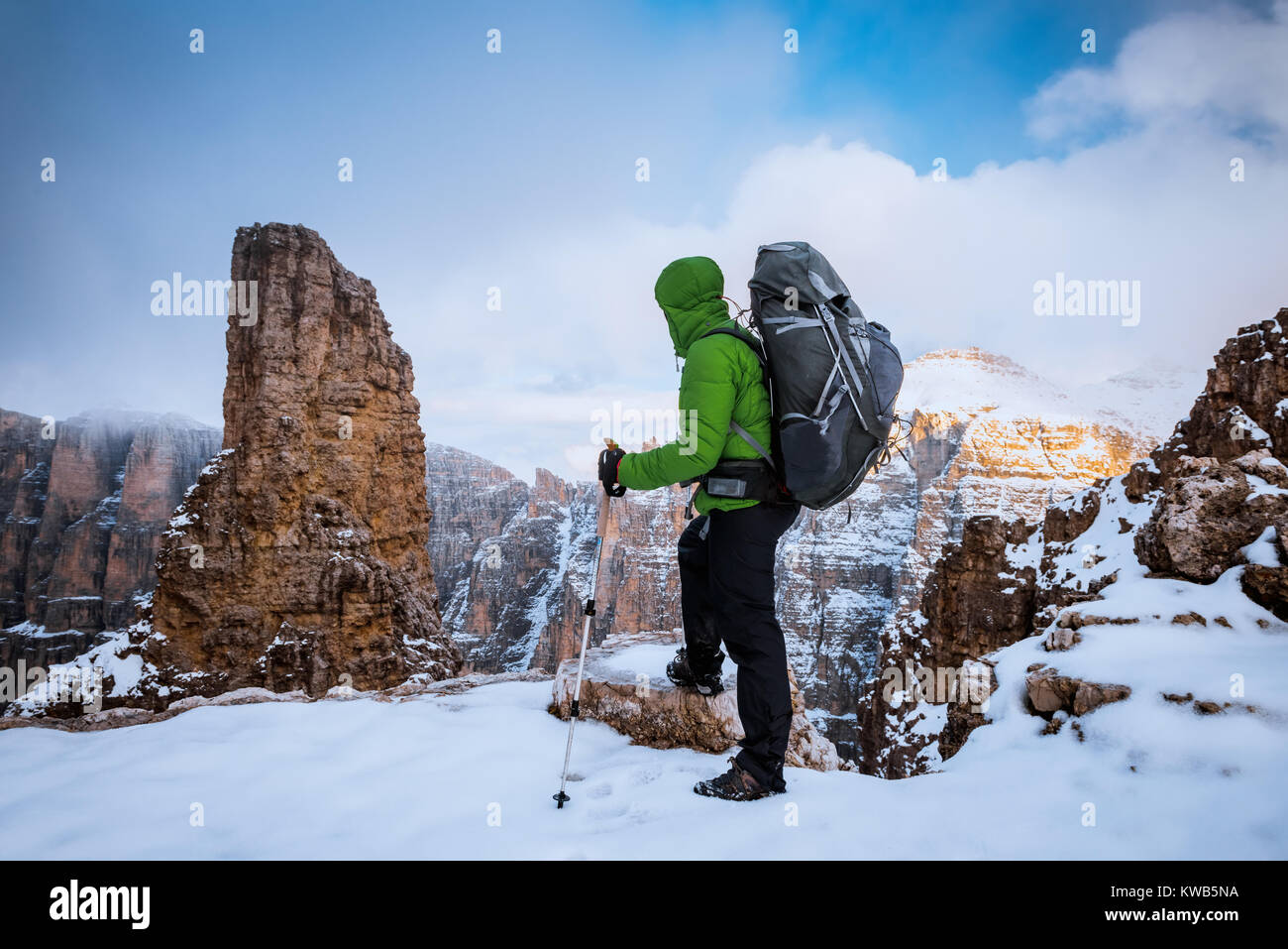 Tourist with backpack hiking in mountains Stock Photo - Alamy