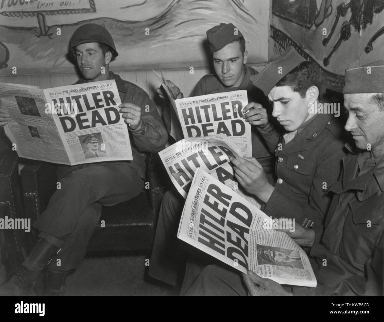 U.S. Soldiers read of Hitler's death in an 'Extra' edition of 'Starts ...